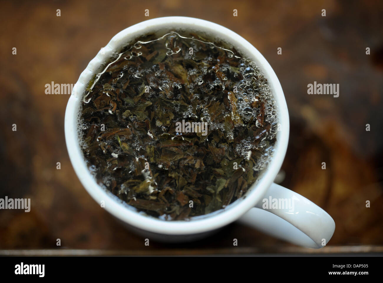 A specimen cup of fresh tea is served during a tea testing of the ...