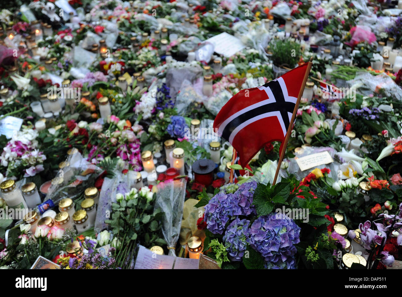 Norwegian flags, flowers and candles commemorating the victims of the ...