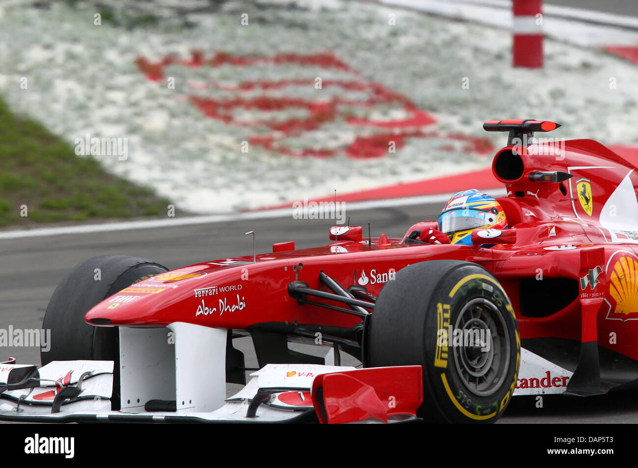 Spanish Formula One driver Fernando Alonso of Ferrari steers his car ...