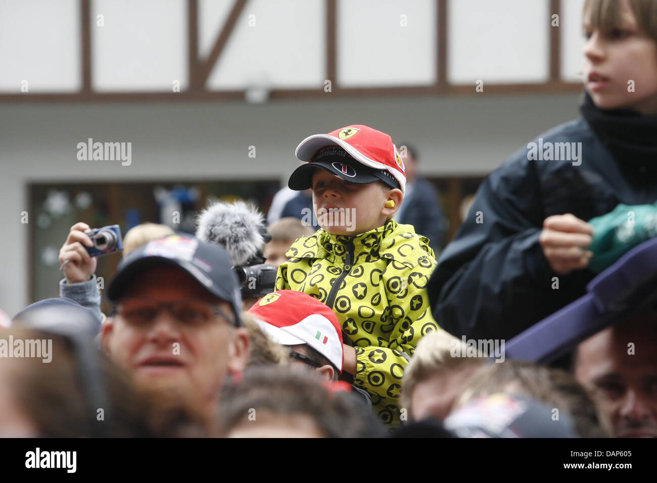 A young supporter seen during the F1 drivers autograph session at the ...
