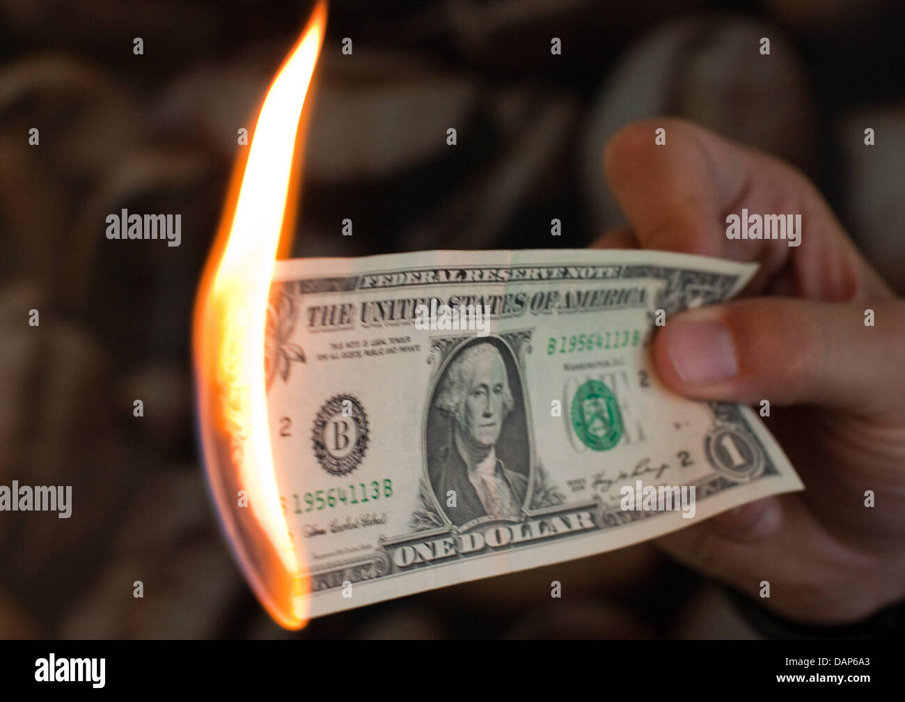 ILLUSTRATION - An one dollar note is on fire in Berlin, Germany, 27 ...
