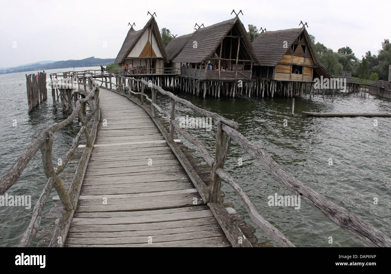 Replicas of Stone Age stilt houses stand in the water of Lake Constance ...