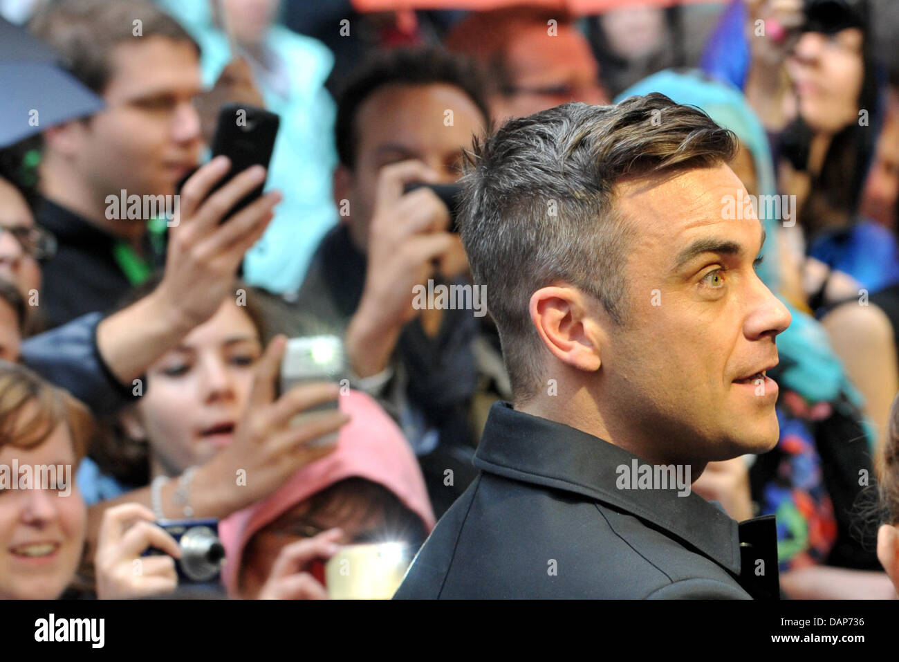 Robbie Williams attends the premiere of the movie 'Cars 2' at the ...