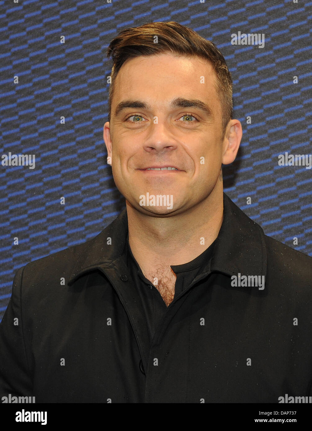Robbie Williams attends the premiere of the movie 'Cars 2' at the ...