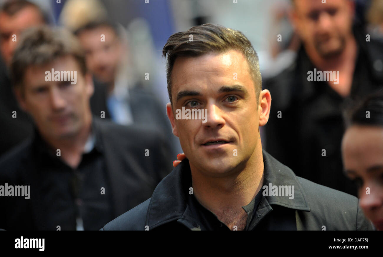 Robbie Williams arrives for the premiere of the movie 'Cars 2' at ...