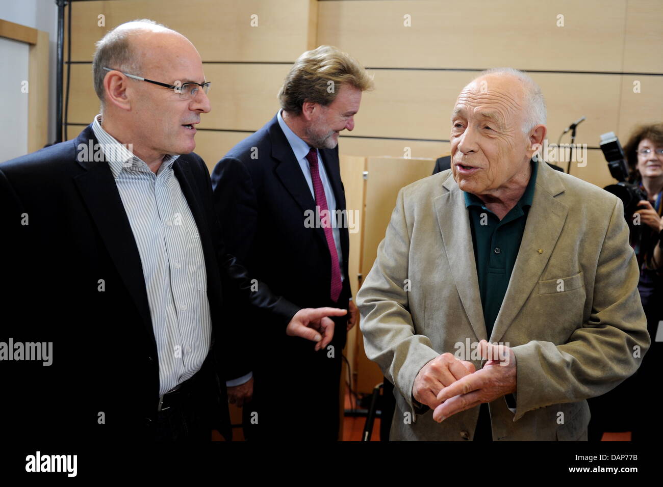 Transport minister of Baden-Wuerttemberg Winfried Hermann (L) speaks to ...