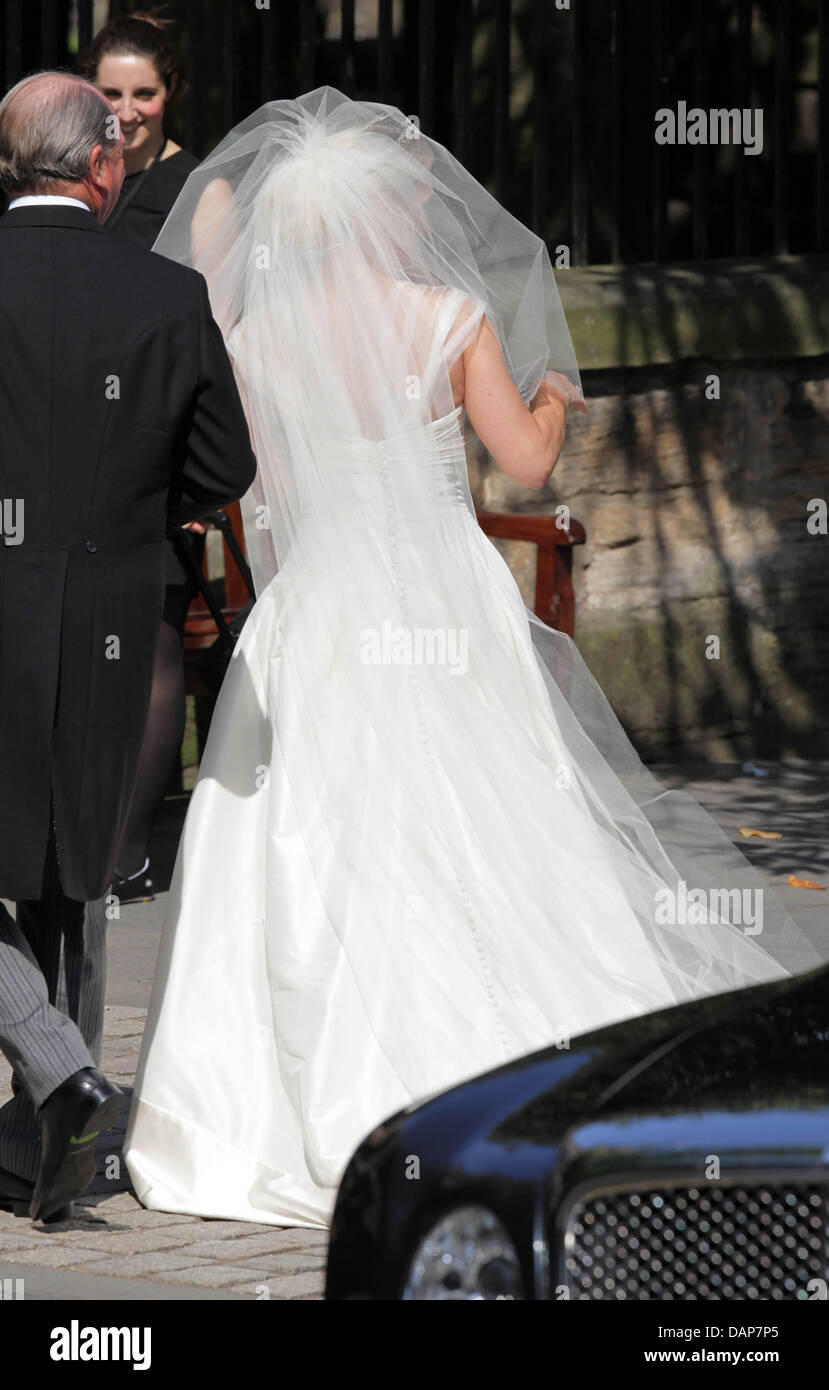 The bride Zara Phillips arrives with her father Captain Mark Phillips ...