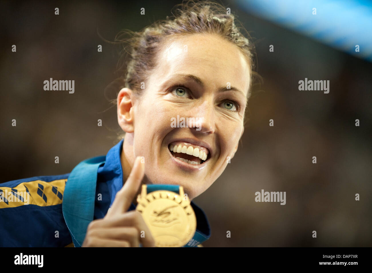 Therese Alshammar of Sweden shows her gold medal after winning the ...
