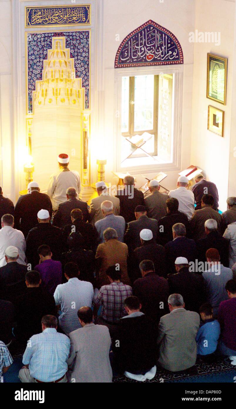 Muslims attend an afternoon prayer at the Sehitlik mosque in Berlin ...