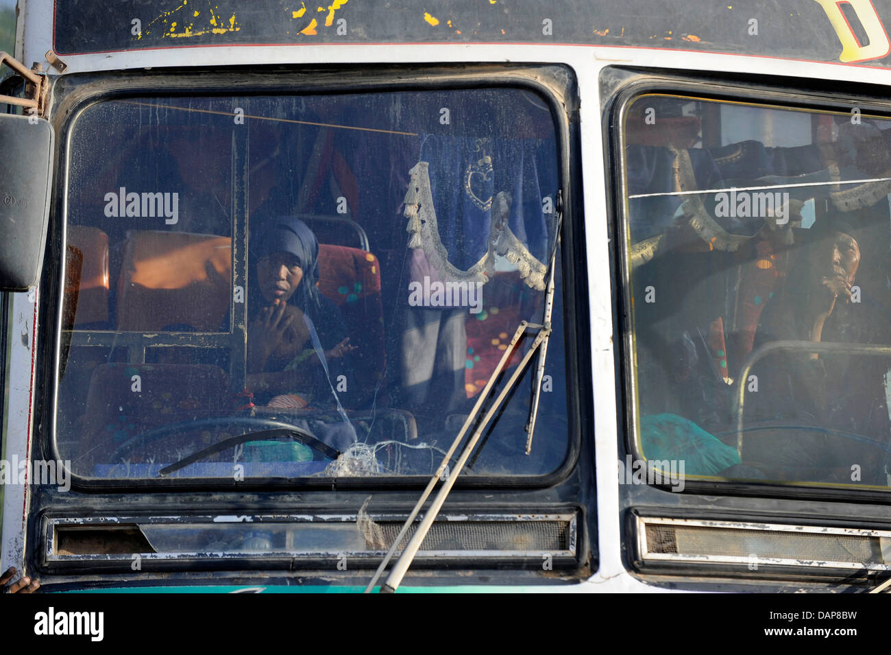 A woman and her child sit in a bus, coming from the Somali boarder, in ...