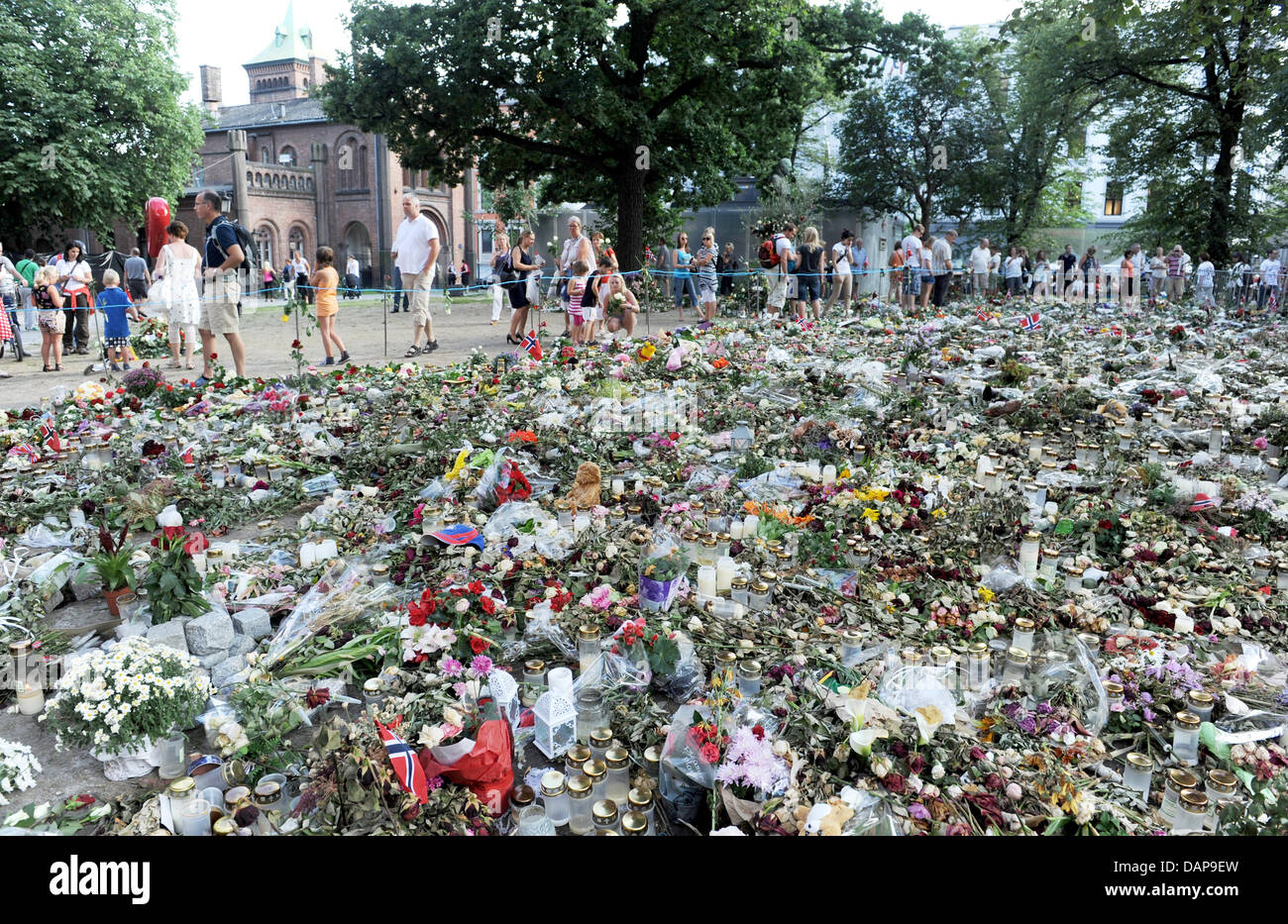 People commemorate the victims of the recent attacks in Norway with ...