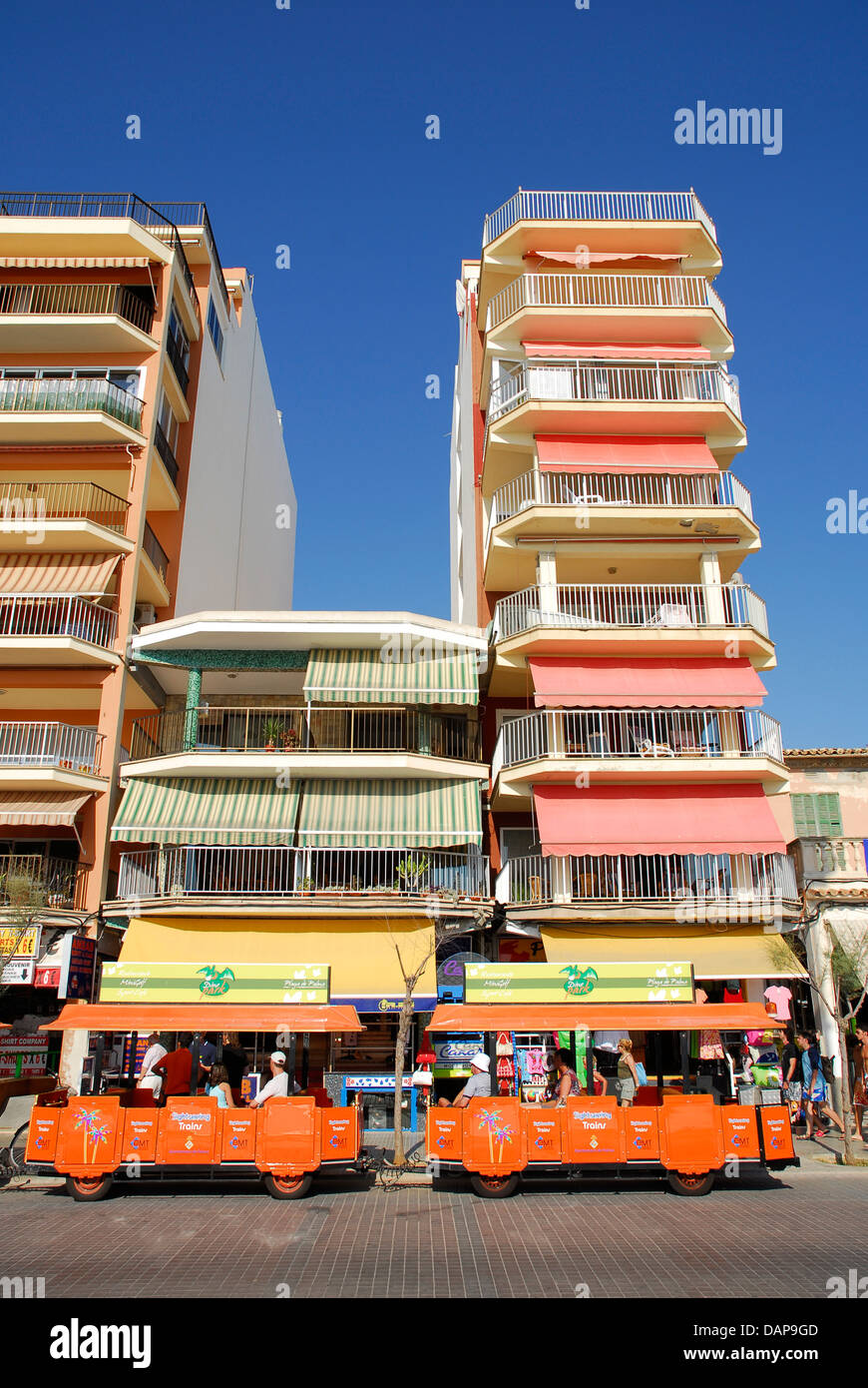Spain, Mallorca, Palma, Orange sightseeing train riding along Arenal ...