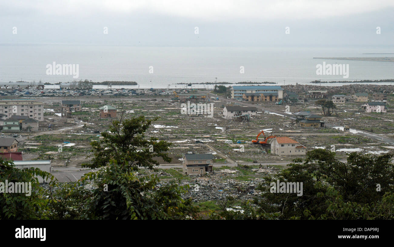 Debris lies about the street, five months after the tsunami hit the ...