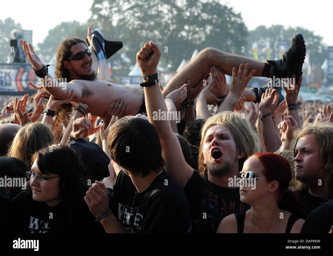 A metal fan crowdsurfs during the first concert of the heavy metal ...