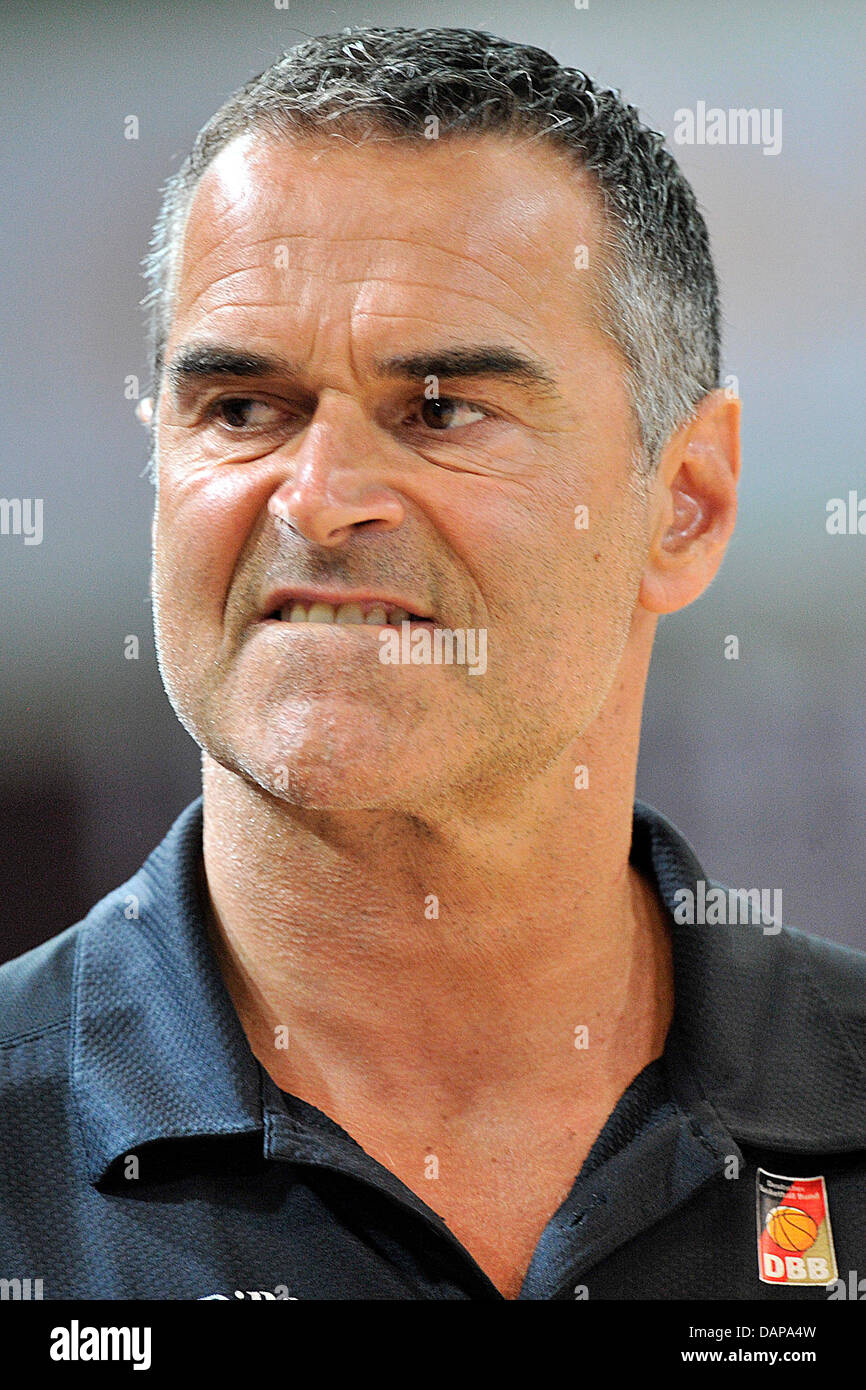 The coach of the German national basketball team Dirk Bauermann bites ...