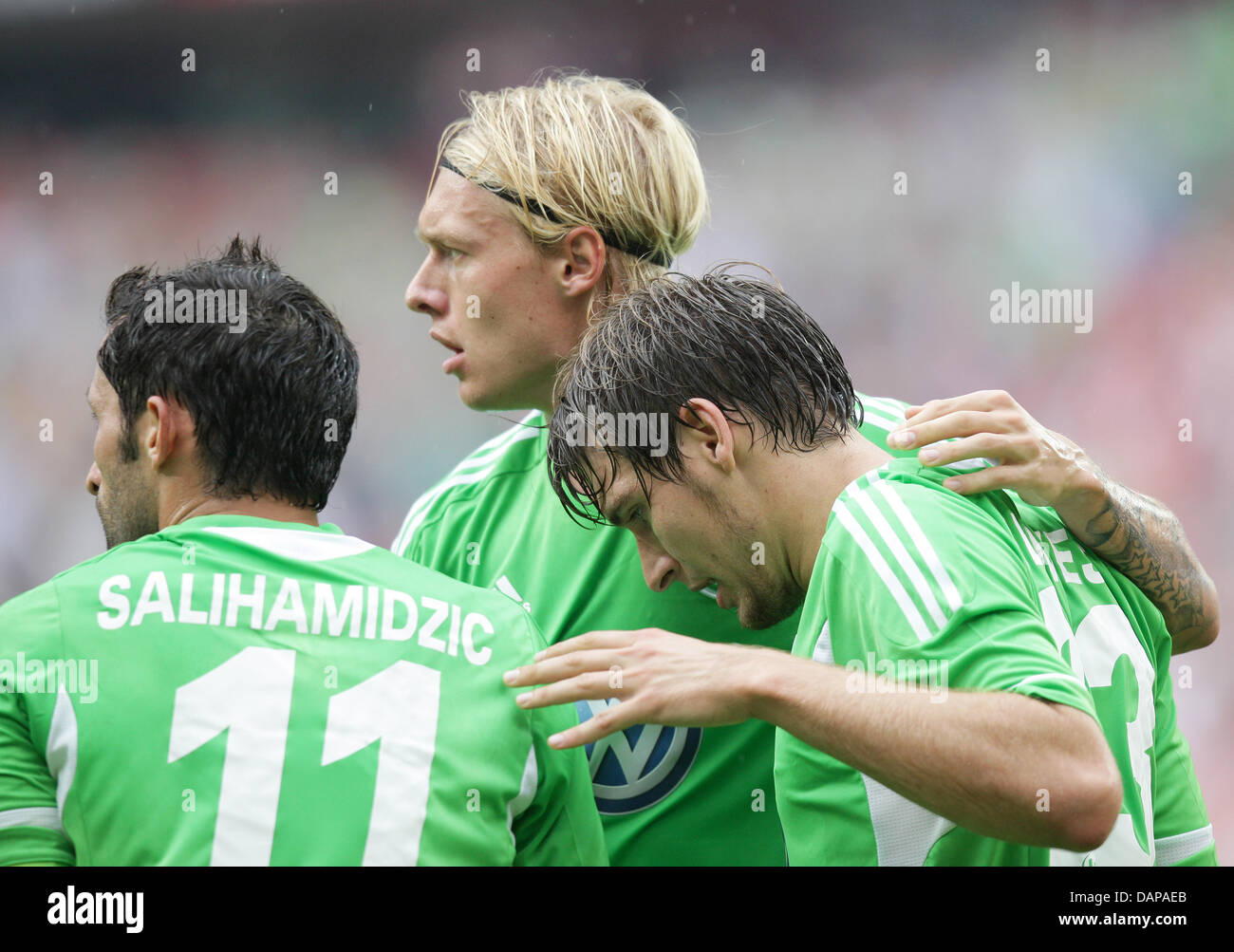 Wolfsburg's Hasan Salihamidzic (L) and Simon Kjaer congratulate Patrick ...