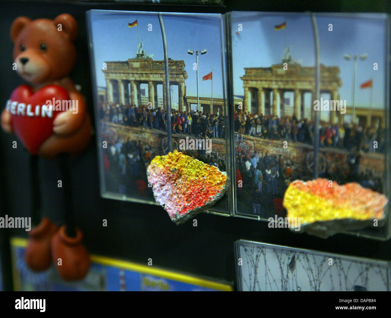 souvenirs with a piece of the Berlin Wall are pictured at a souvenir ...