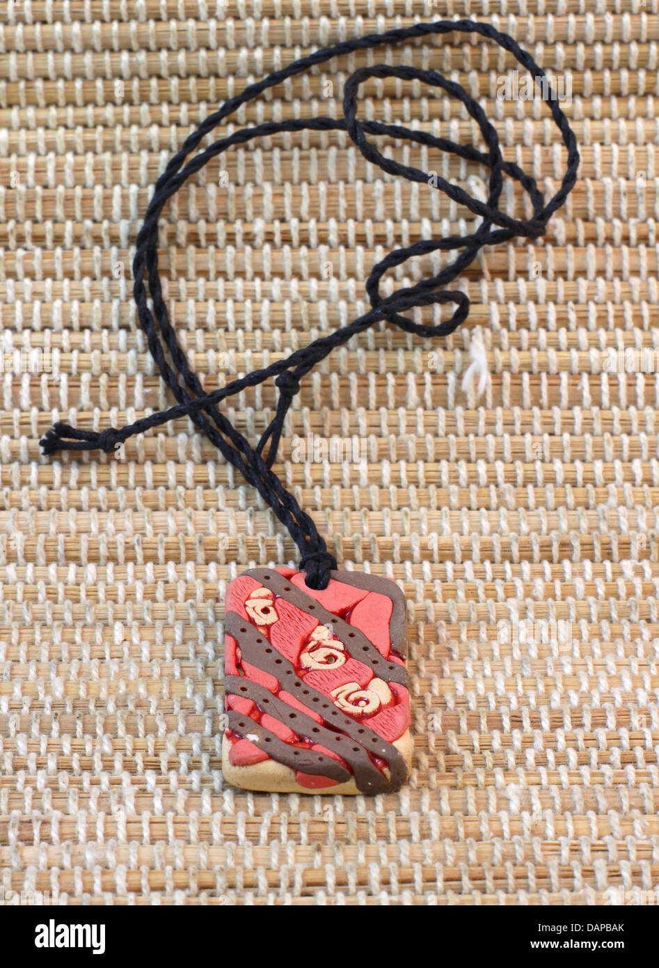 clay handmade red, grey and white amulet love Stock Photo - Alamy