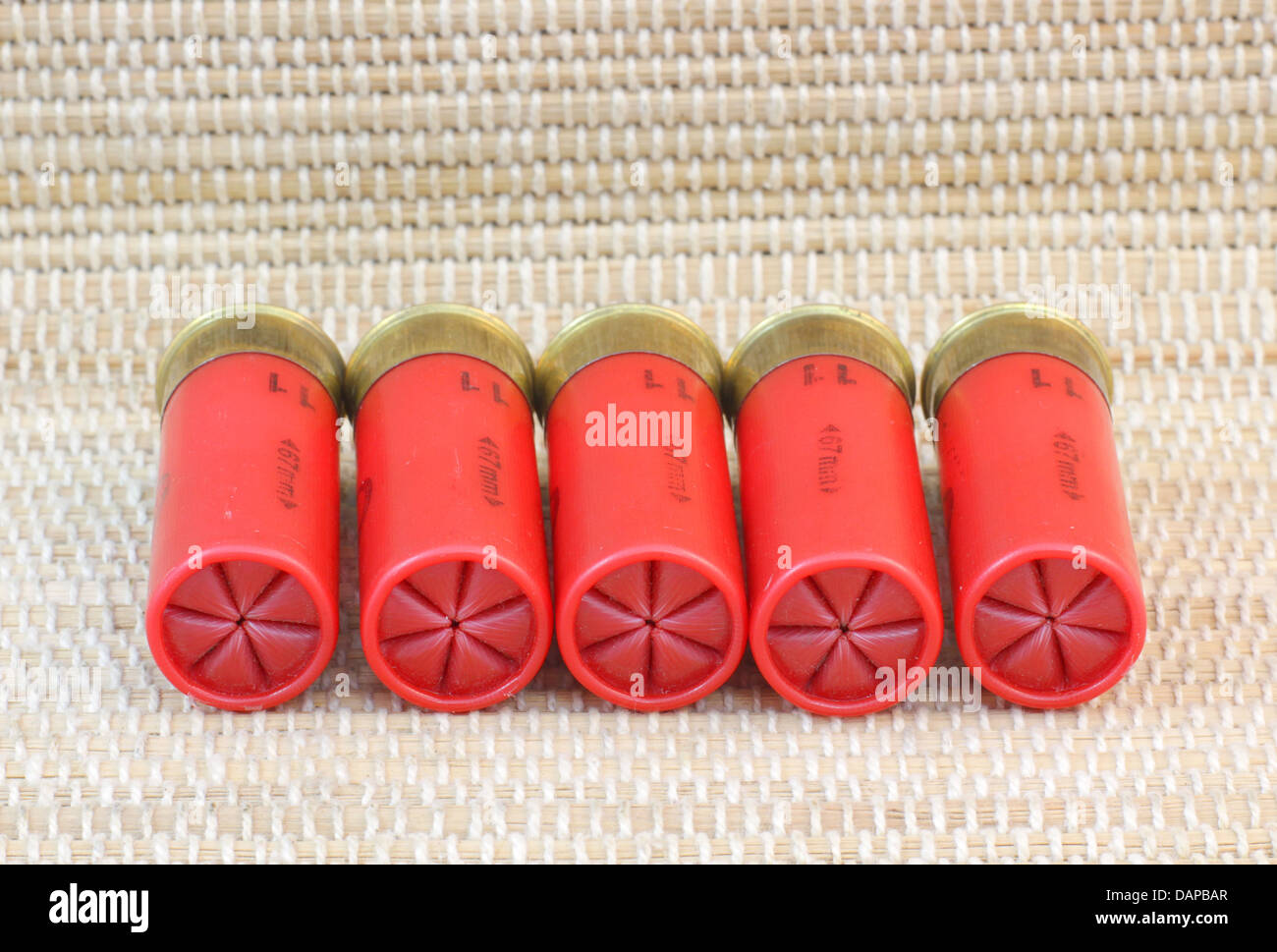 five red shotgun cartridges 11 Stock Photo - Alamy