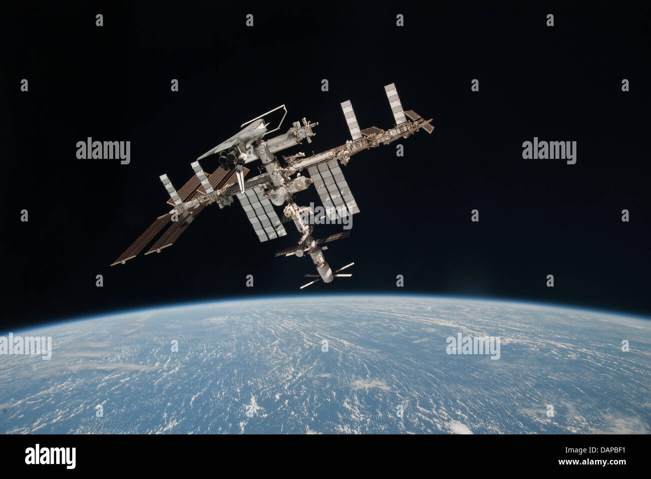 This image of the International Space Station and the docked space ...