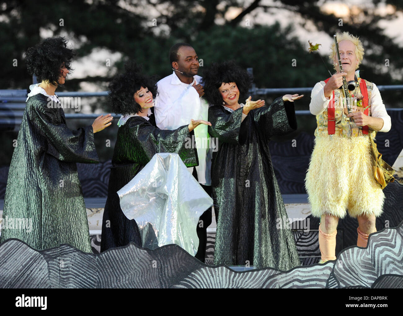 Musa Nkuna (3-L) as Tamino, Guntbert Warns as Papageno (R) and the ...
