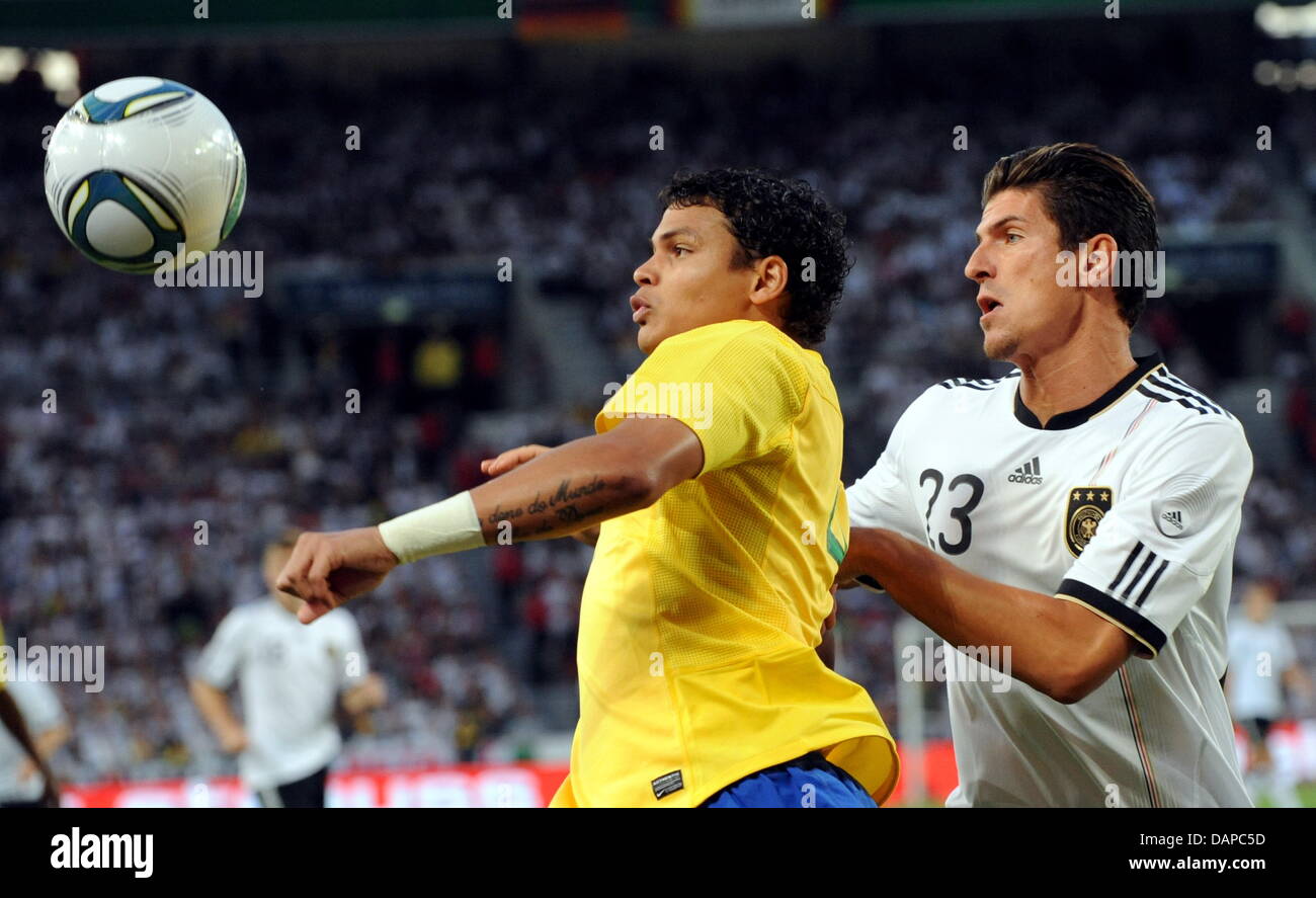 Germany's Mario Gomez (R) and Brazil's Thiago Silva (L) fight for the ...