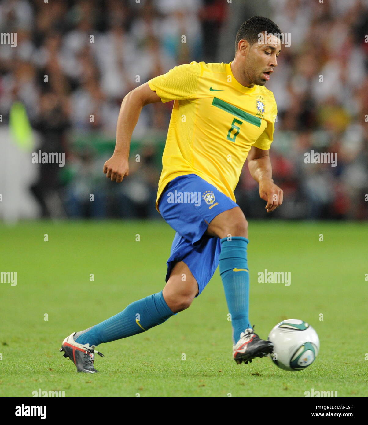 Brazilian player Andre Santos controls the ball during the friendly ...