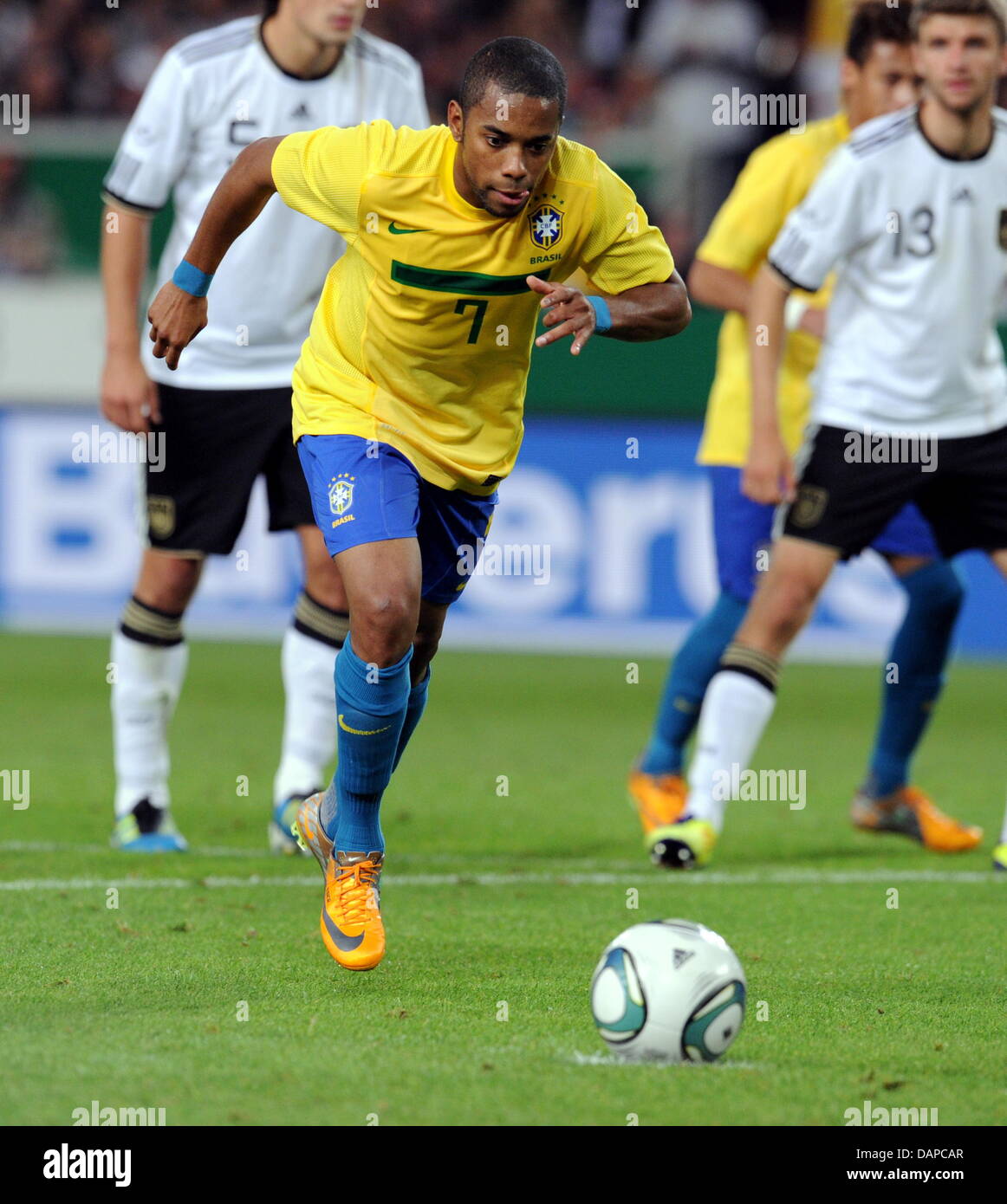 Brazilian player Robinho performs a penalty kick during the friendly ...