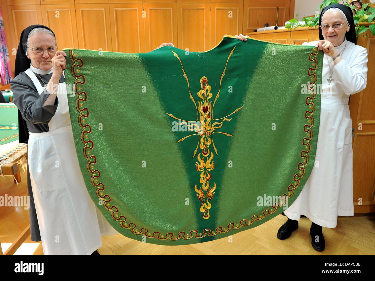 Sister Viola (R) and sister Benita present the new vestment for the ...