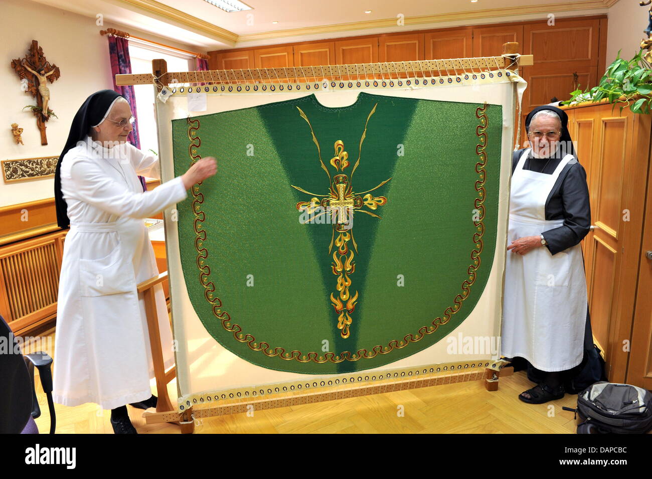 Sister Viola (L) and sister Benita present the new vestment for the ...