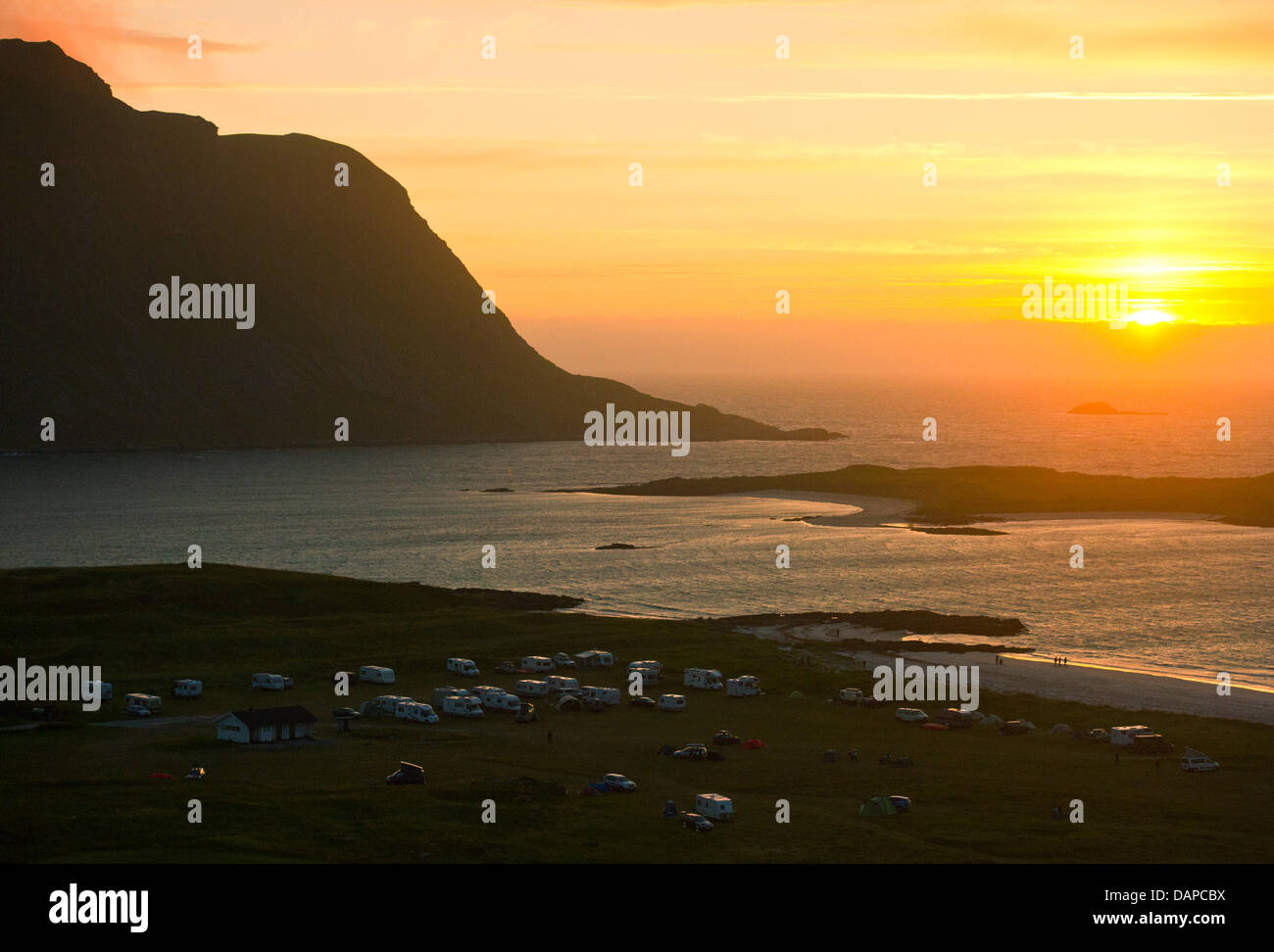 A camping site is visible in the midnight sun near the small fishing ...