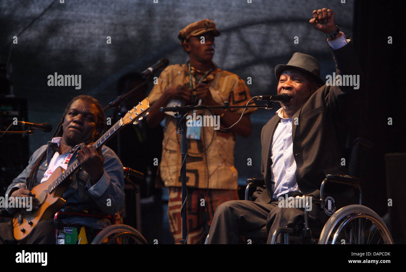 Musicians of the band 'Staff Benda Bilili' perform during the festival ...