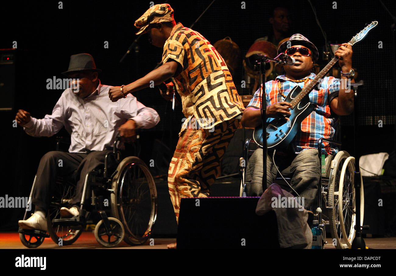 Musicians of the band 'Staff Benda Bilili' perform during the festival ...