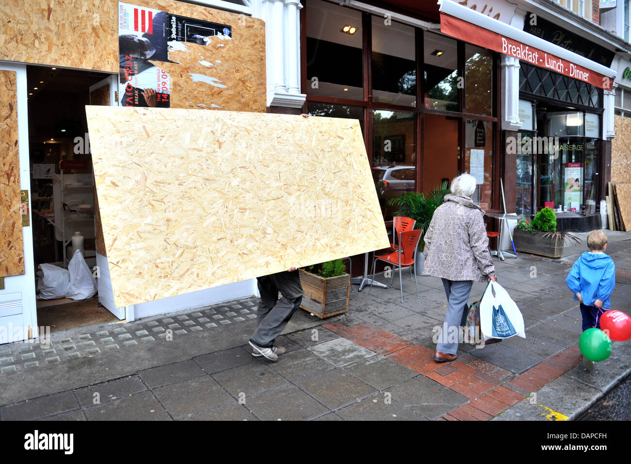 A man carries a wooden plank in Ealing, London, Great Britain, 11 ...