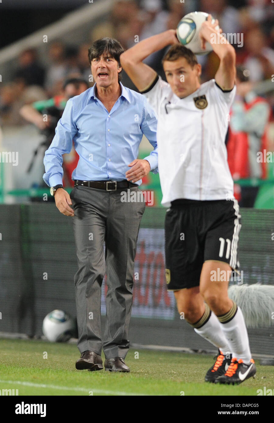 German national coach Joachim Loew (L) shouts directions to Miroslav ...