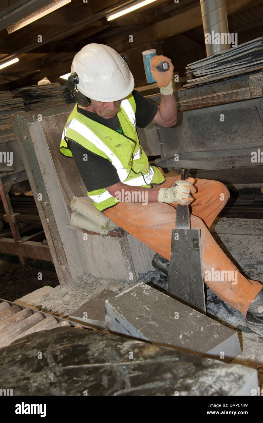 Splitting slate using a chisel and hammer at Delabole slate quarry ...