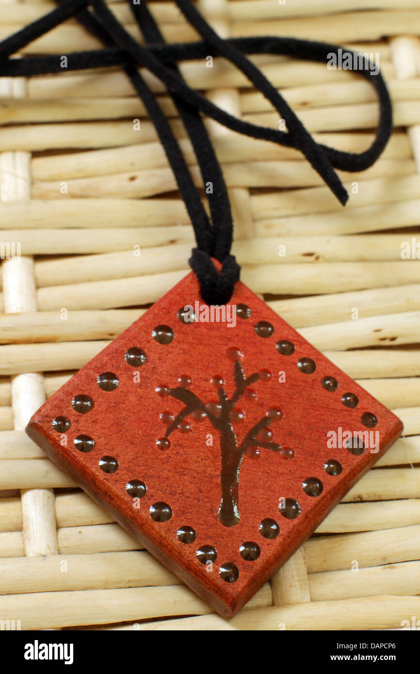 clay red magic amulet with tree Stock Photo - Alamy