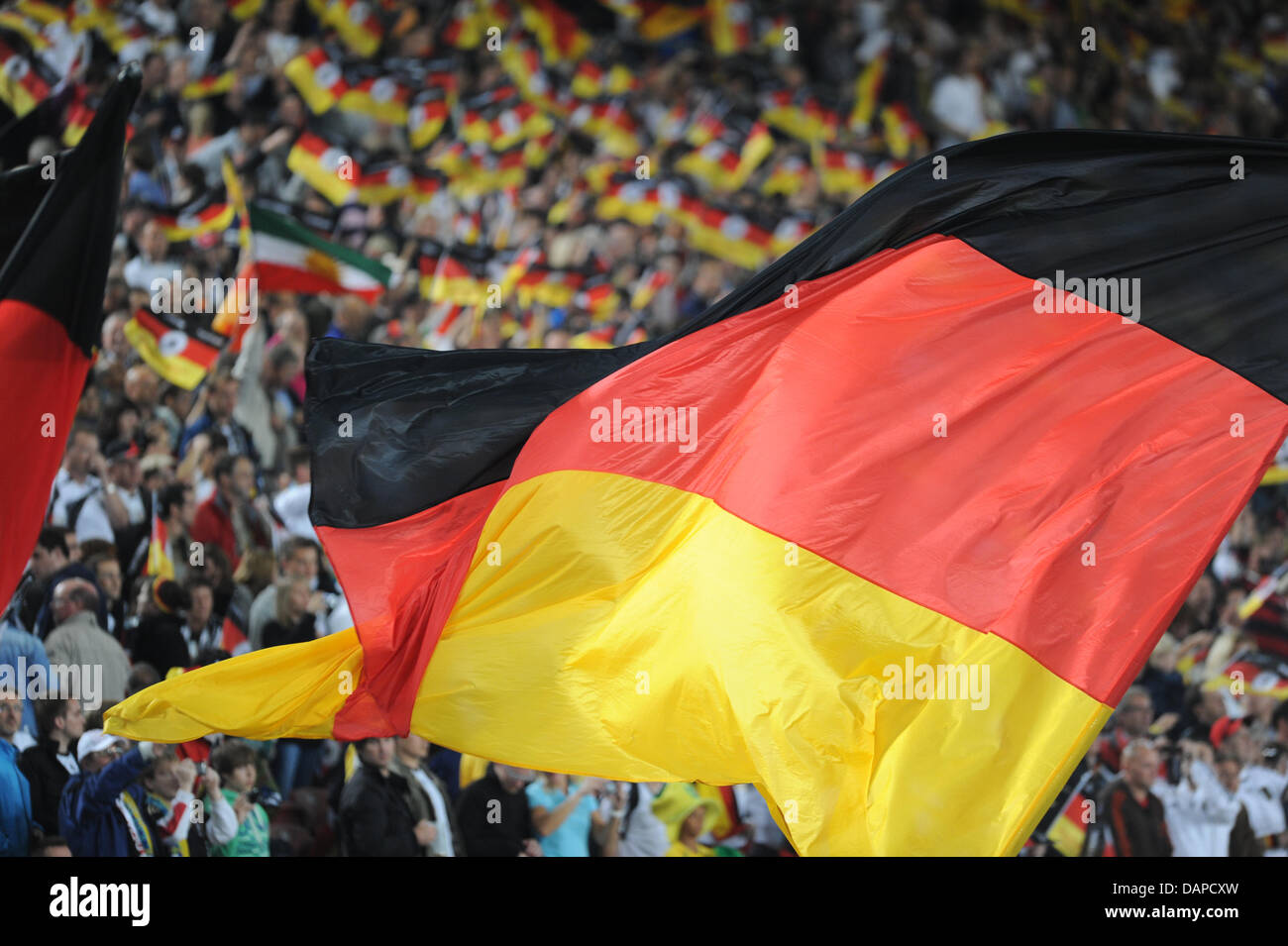 German fans wave with flags during to the friendly match Germany vs ...