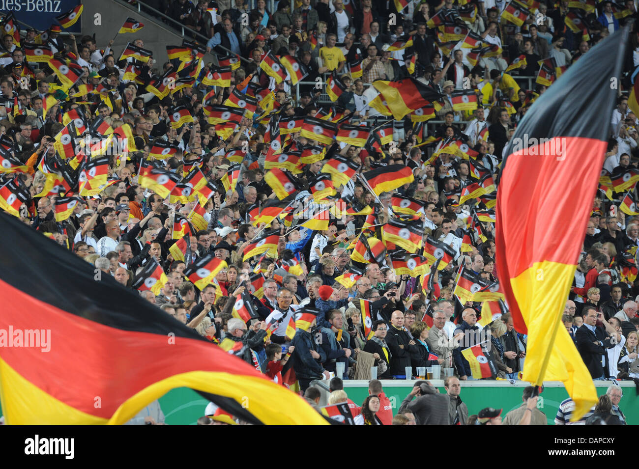 German fans wave with flags during to the friendly match Germany vs ...