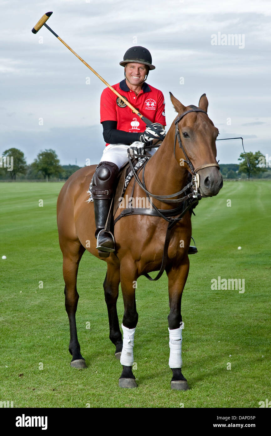 USA's polo athlete Mike Azzaro rides on a polo horse across a polo ...