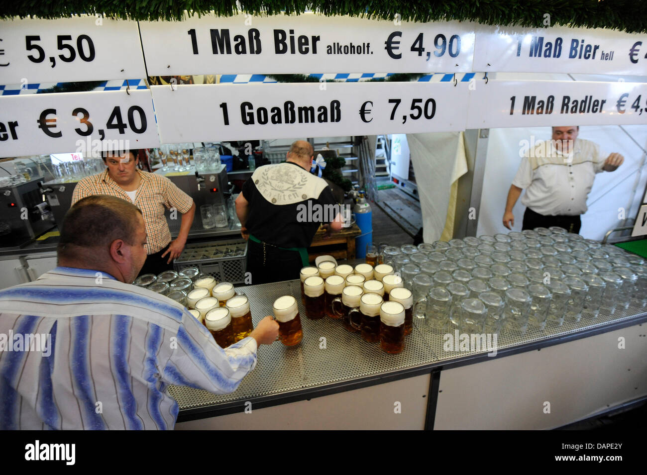 Price signs display the low prices for beer at the folk festival in ...
