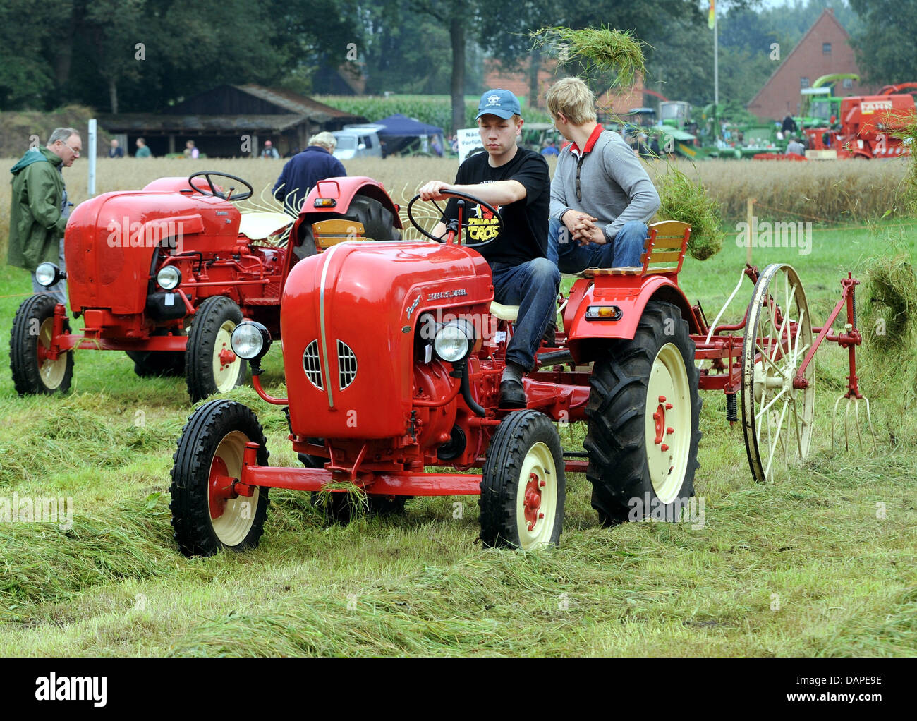Dutch farmers Erwin Jonas (L) and Bob Schroten present a restored 1960 ...