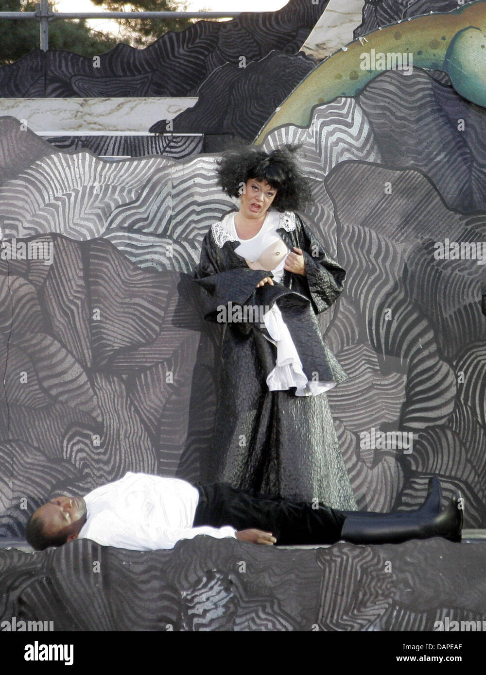Musa Nkuna performs as the Tamino (below) during rehearsal for the ...