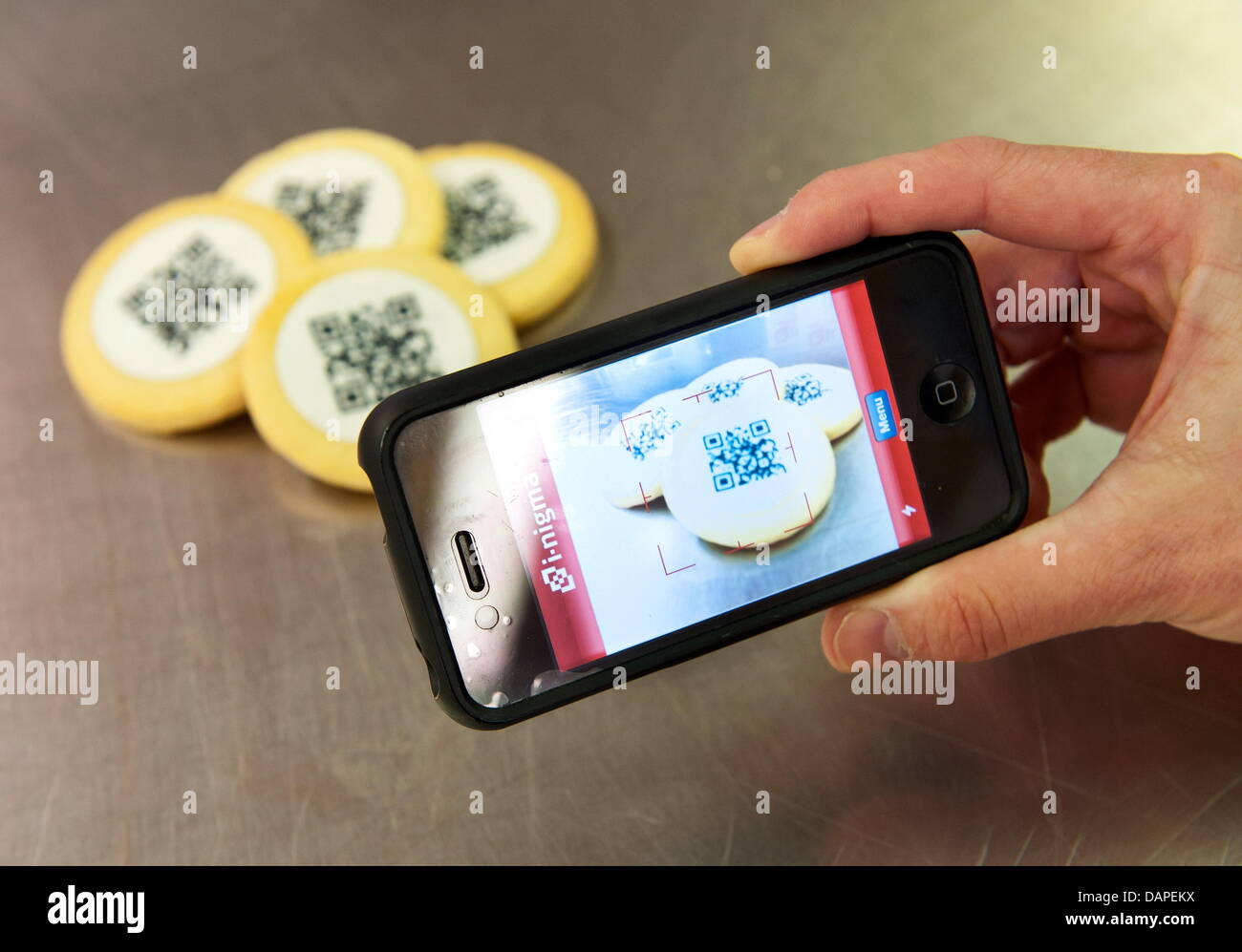 A smartphone reads the food coloring barcodes on cookies and deciphers ...