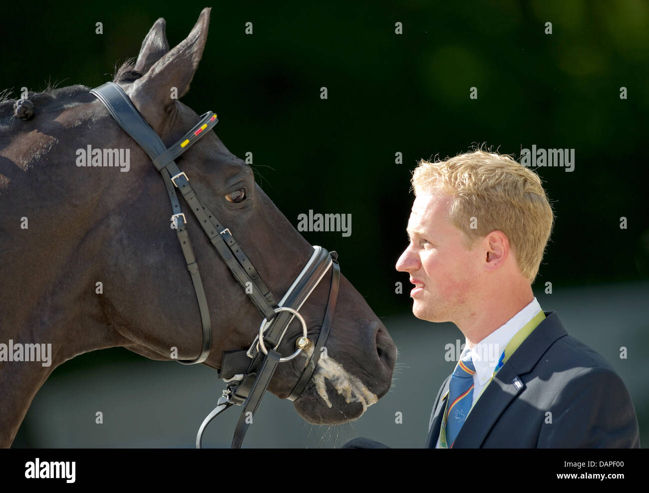 German dressage rider Matthias Alexander Rath looks at his horse ...