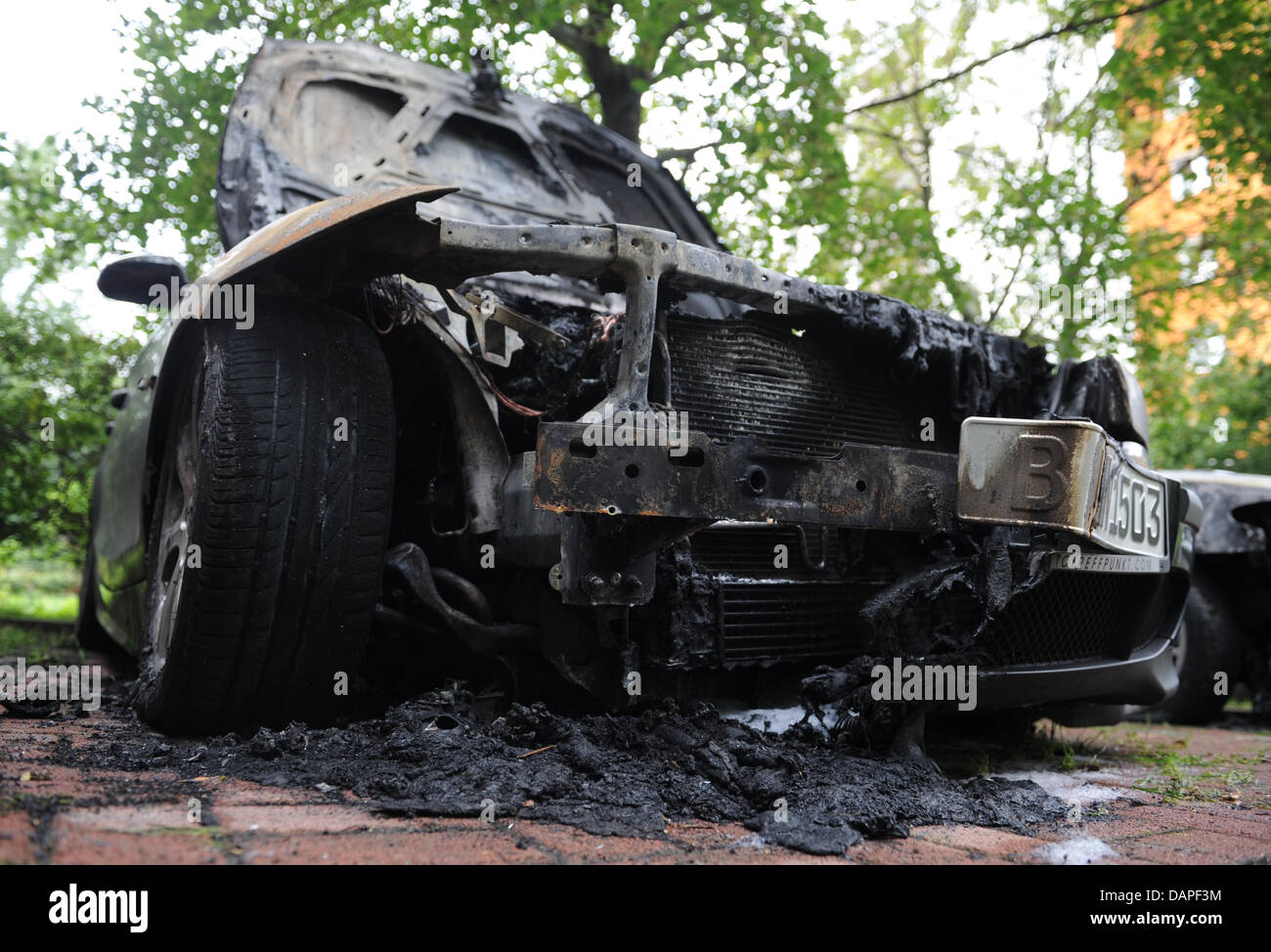 A burned out BMW stands on a parking lot in Berlin, Germany, 17 August ...