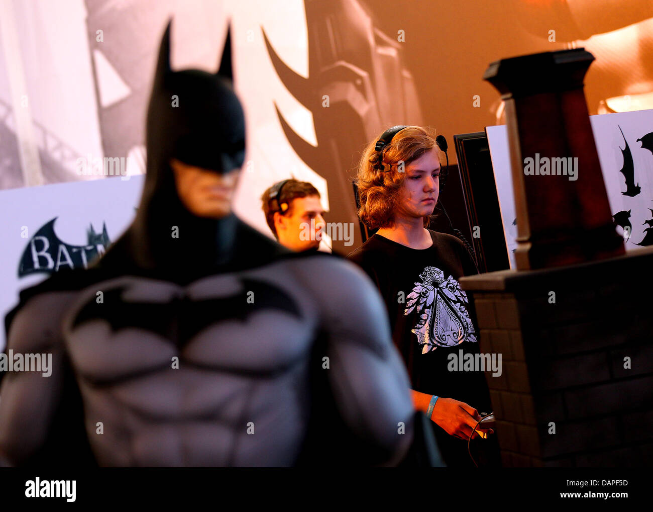 A computer gamer plays a Batman game at the Gamescom fair in Cologne ...