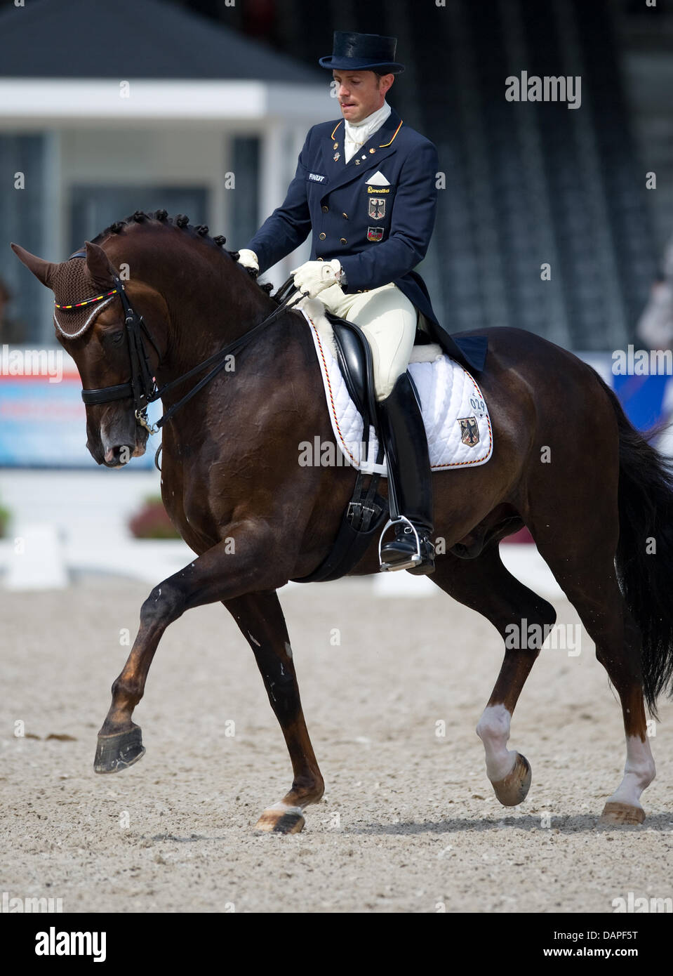 German dressage rider Christoph Koschel rides his horse Donnperignon ...