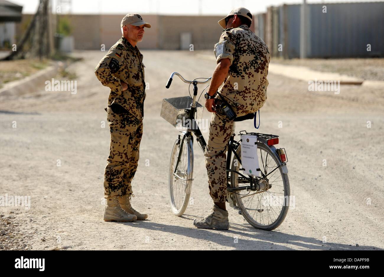 Soldiers of the German Bundeswehr talk to each other at the German ...
