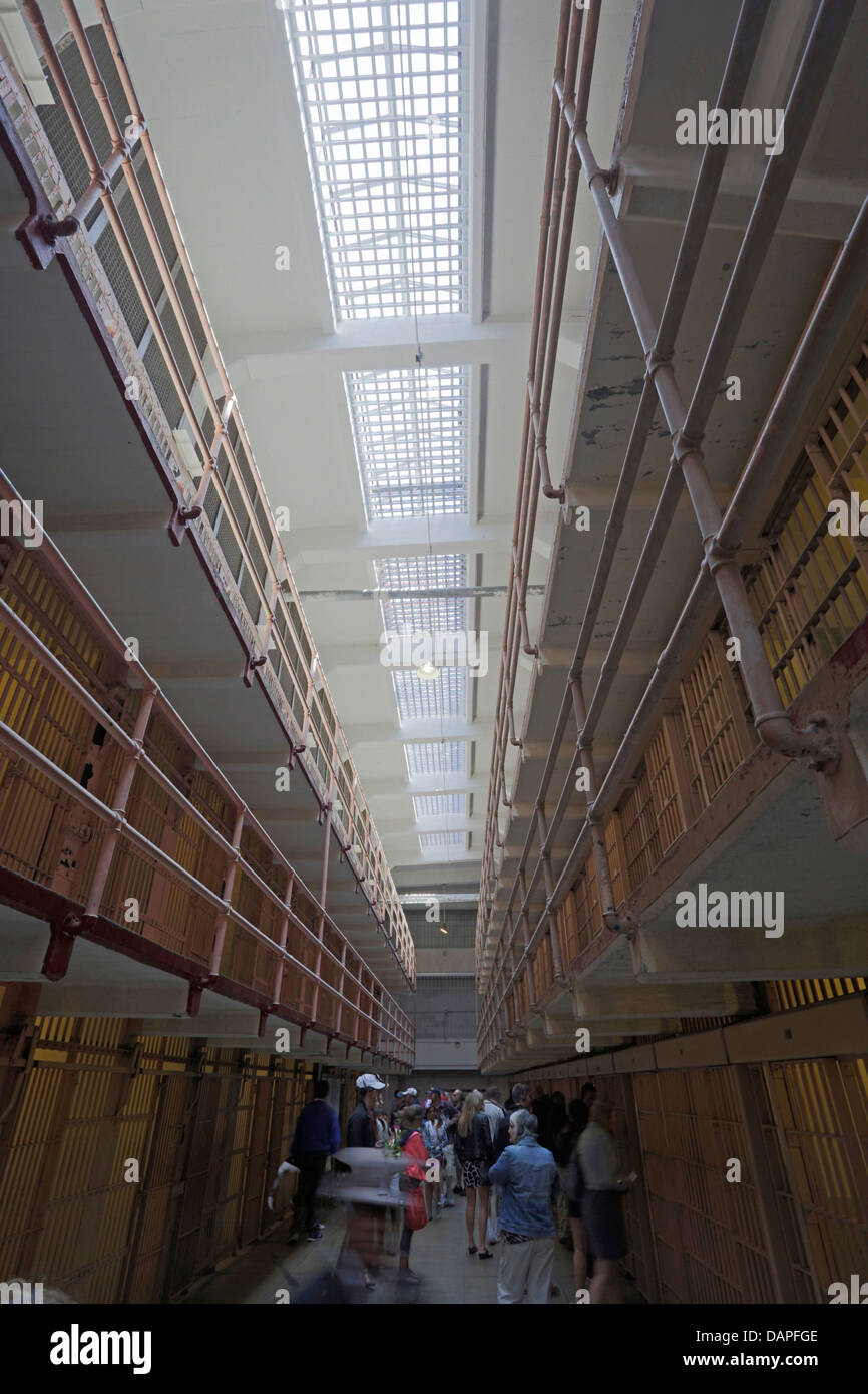 People viewing line of prison cells in Alcatraz prison San Francisco ...